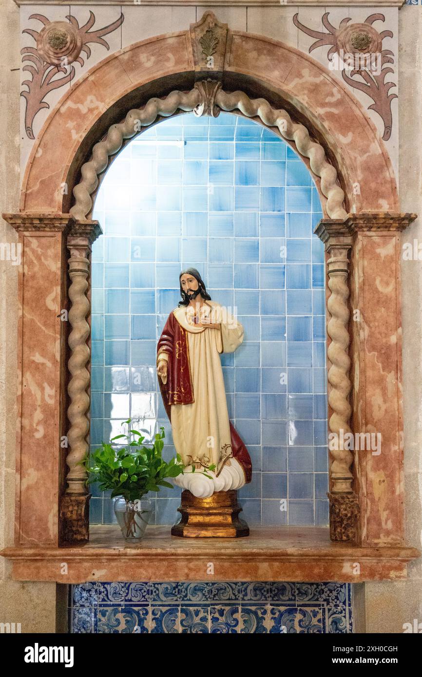 Religious statue of a saint inside the church located in the castle in ...