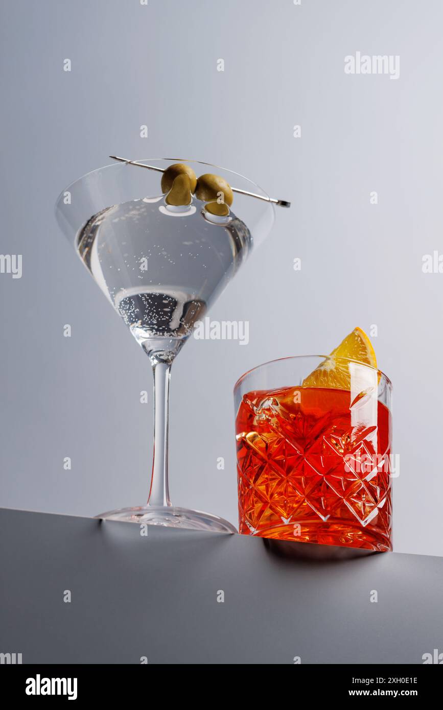 Cocktail delight: Vibrant drinks against a grey background with copy ...