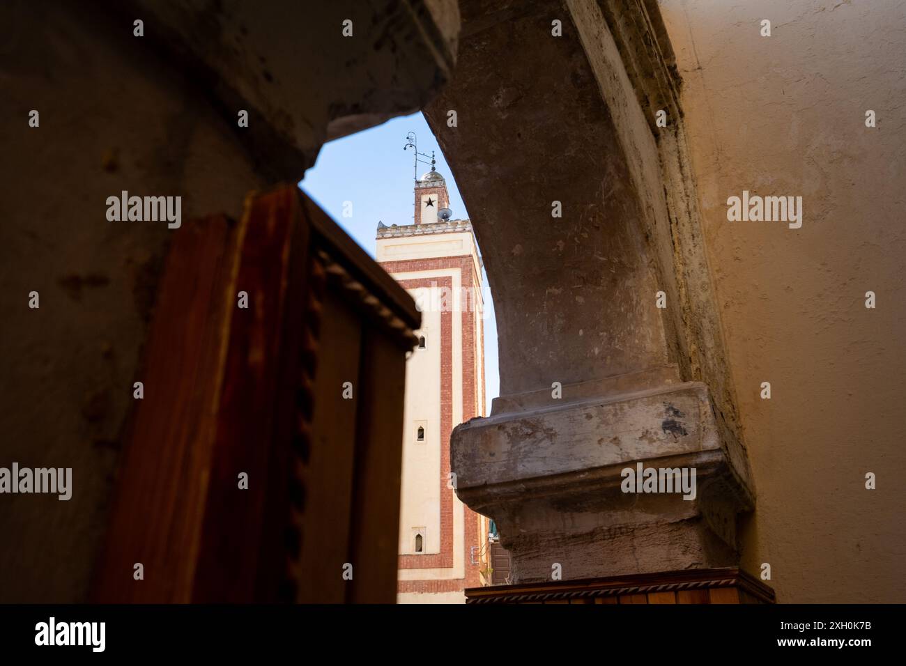 View of the minaret of a mosque in the medina of Fez in Morocco. It can ...