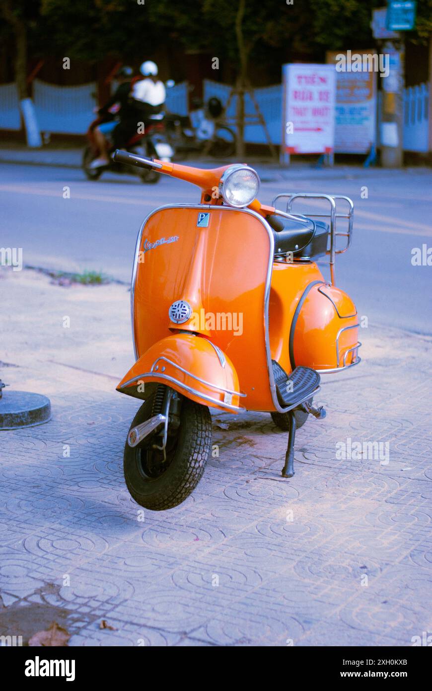 vintage orange motorcycle on the street Stock Photo - Alamy