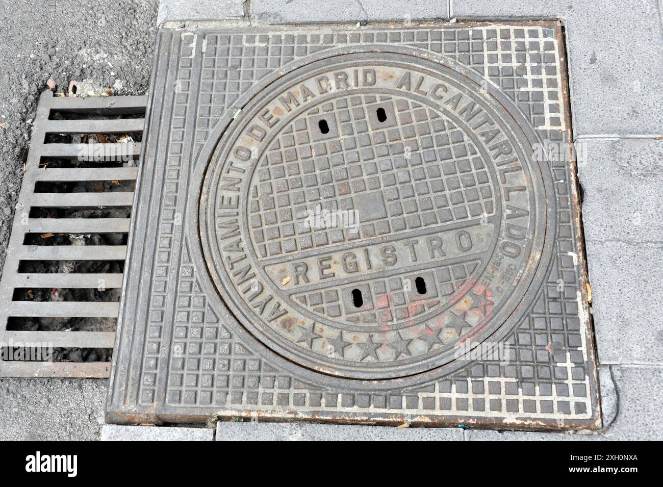 Madrid, Spain, Europe, Round metal manhole cover with lettering on a ...