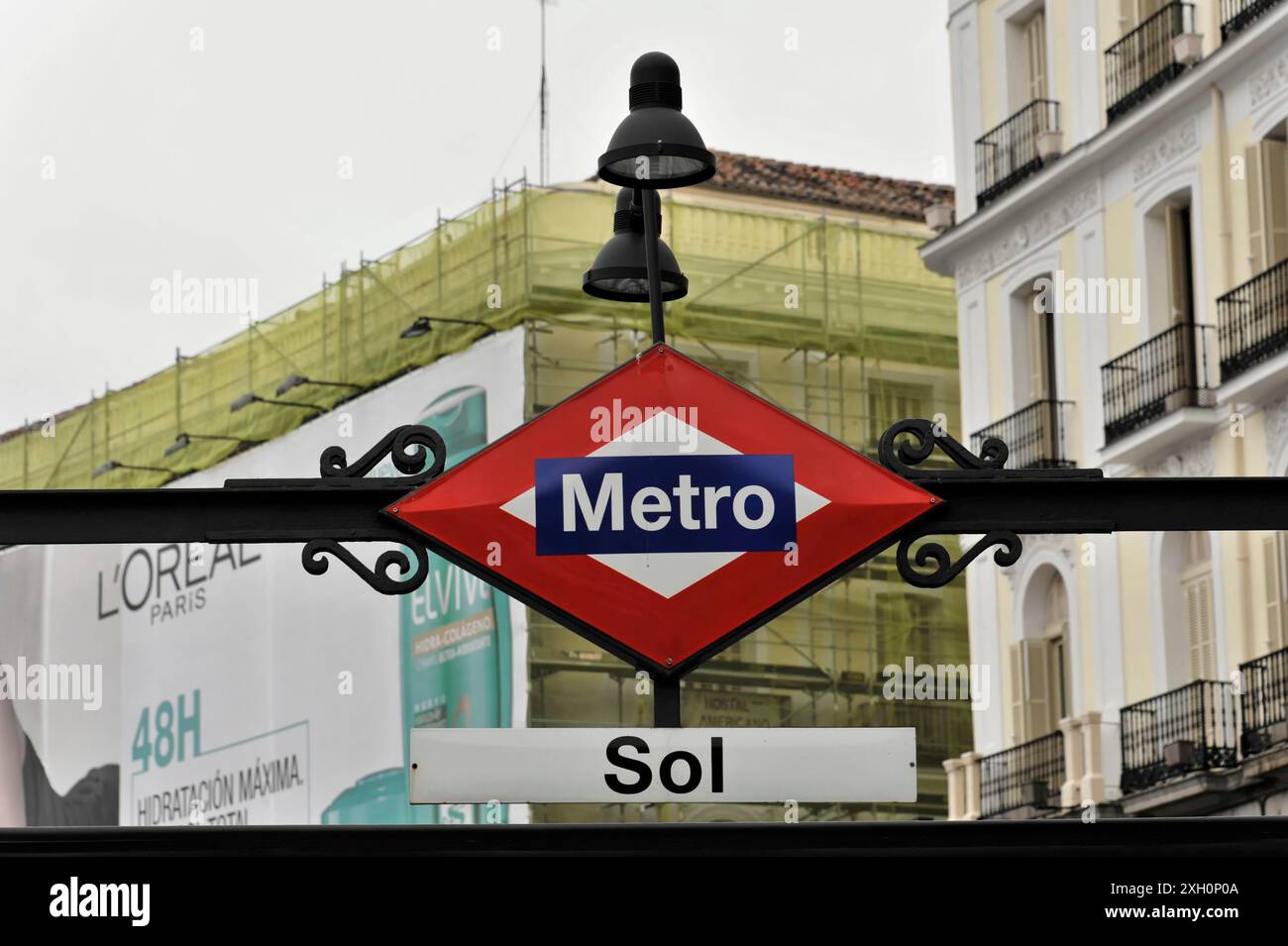 Madrid, Spain, Europe, Entrance to Sol metro station with a large red ...