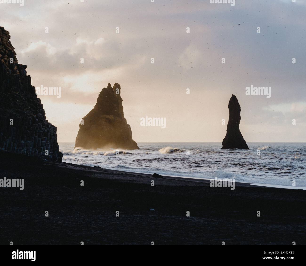 Sunrise view of Reynisfjara beach with its iconic sea stacks, located ...