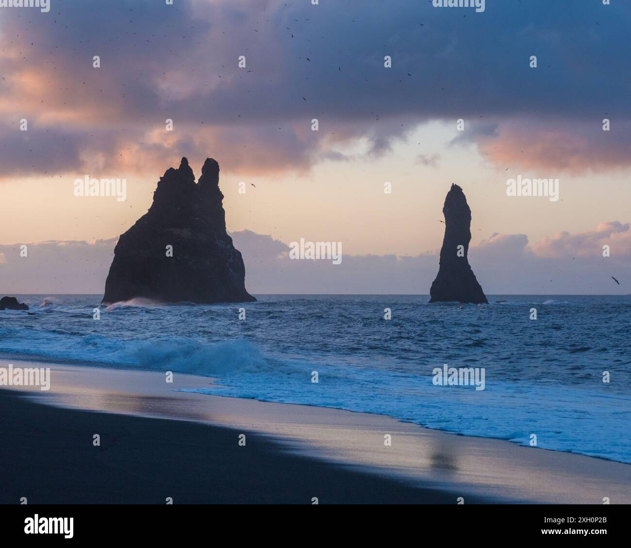 Sunrise view of Reynisfjara beach with its iconic sea stacks, located ...