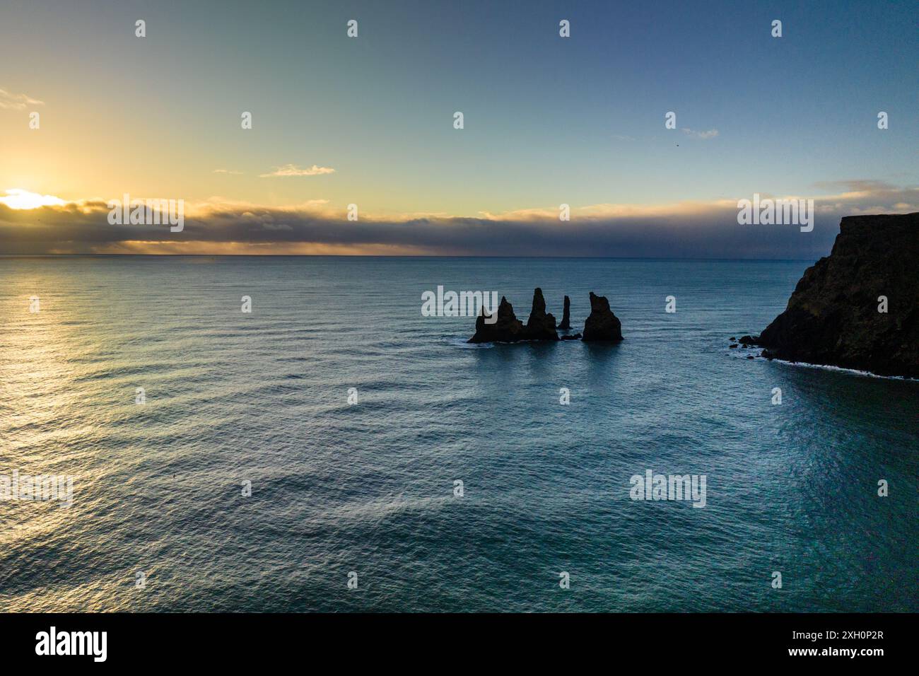 Aerial view of the Reynisdrangar sea stacks along the south coast of ...