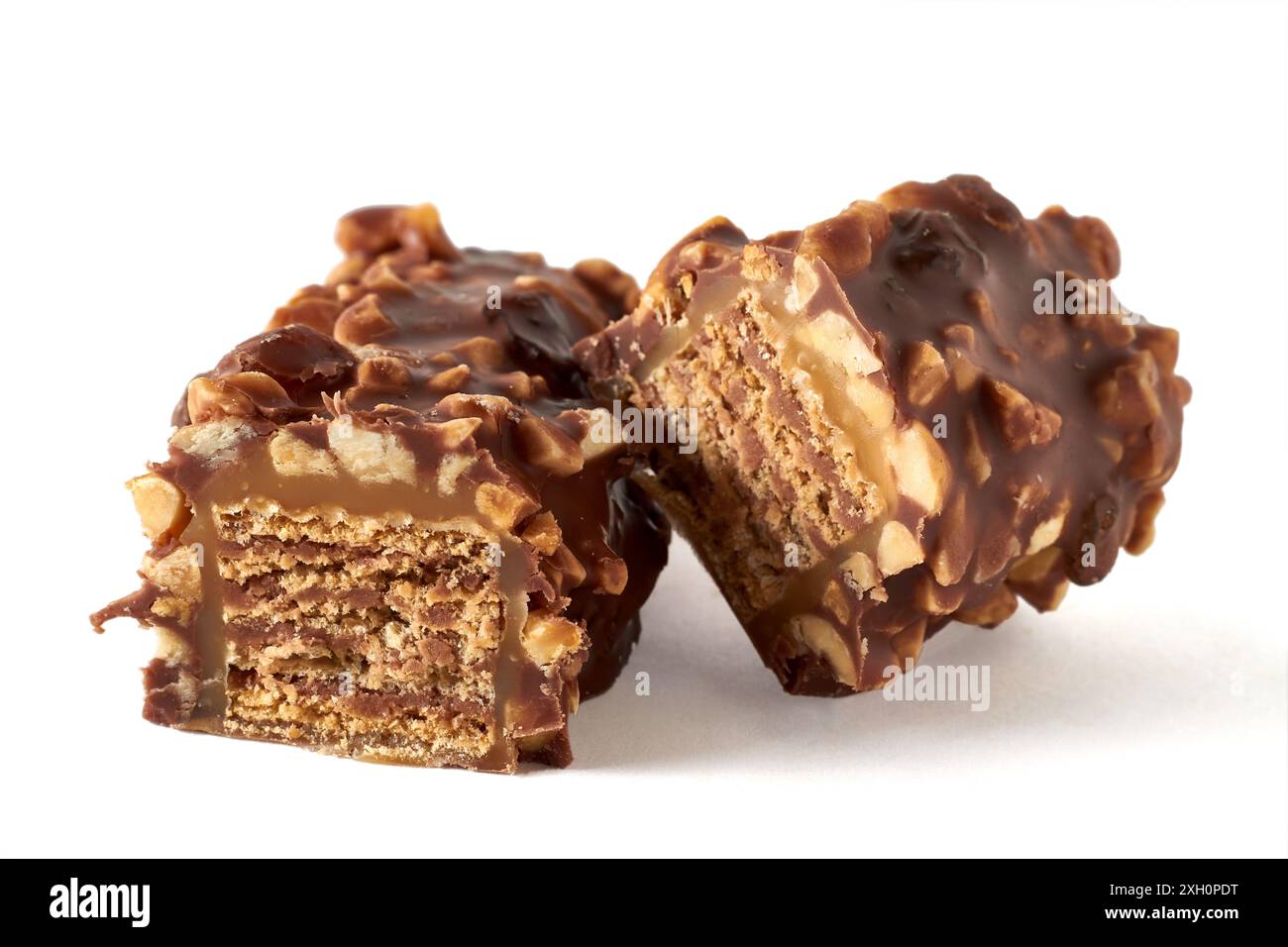 Chocolate wafer bar with caramel and peanuts in a cut isolated on a ...