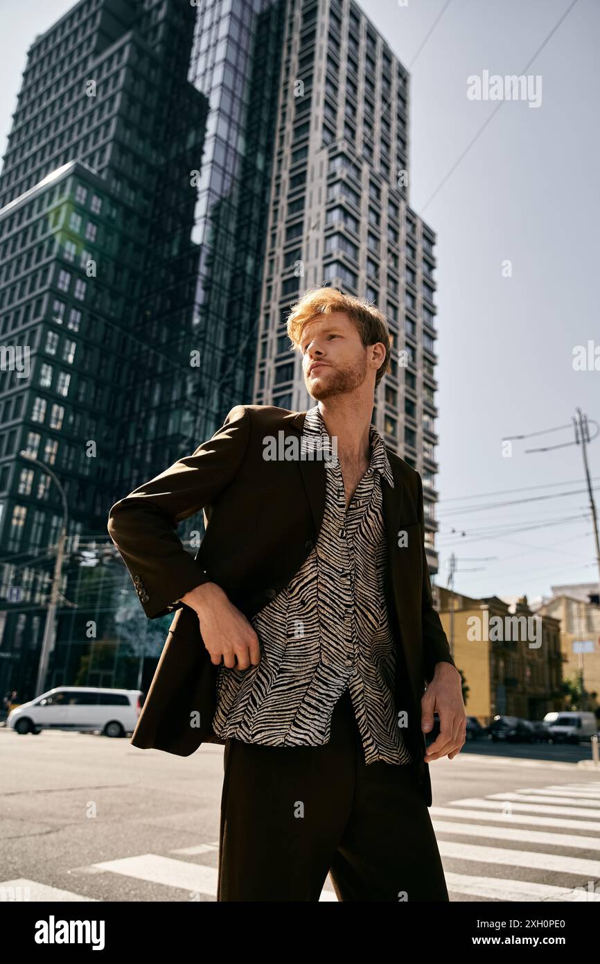 A young red-haired man in debonair attire confidently crosses a city ...