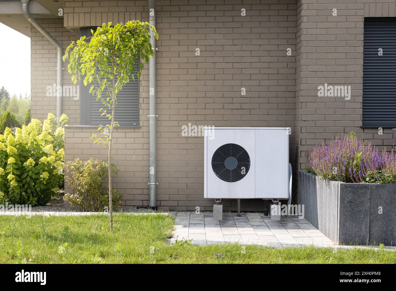 Heat Pump System Installed on Modern Building Exterior Stock Photo - Alamy
