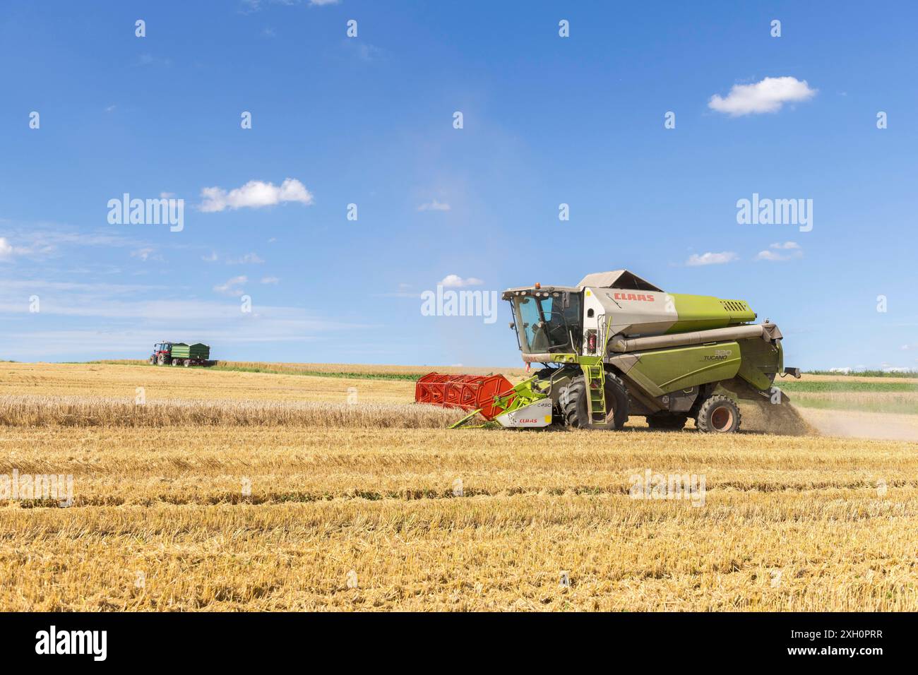 Combine harvester harvesting grain, Harvesting wheat, Tractor, Baden ...