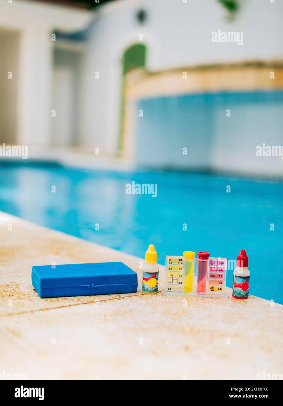 Chlorine and ph tester for swimming pools. Water test kit on the edge ...