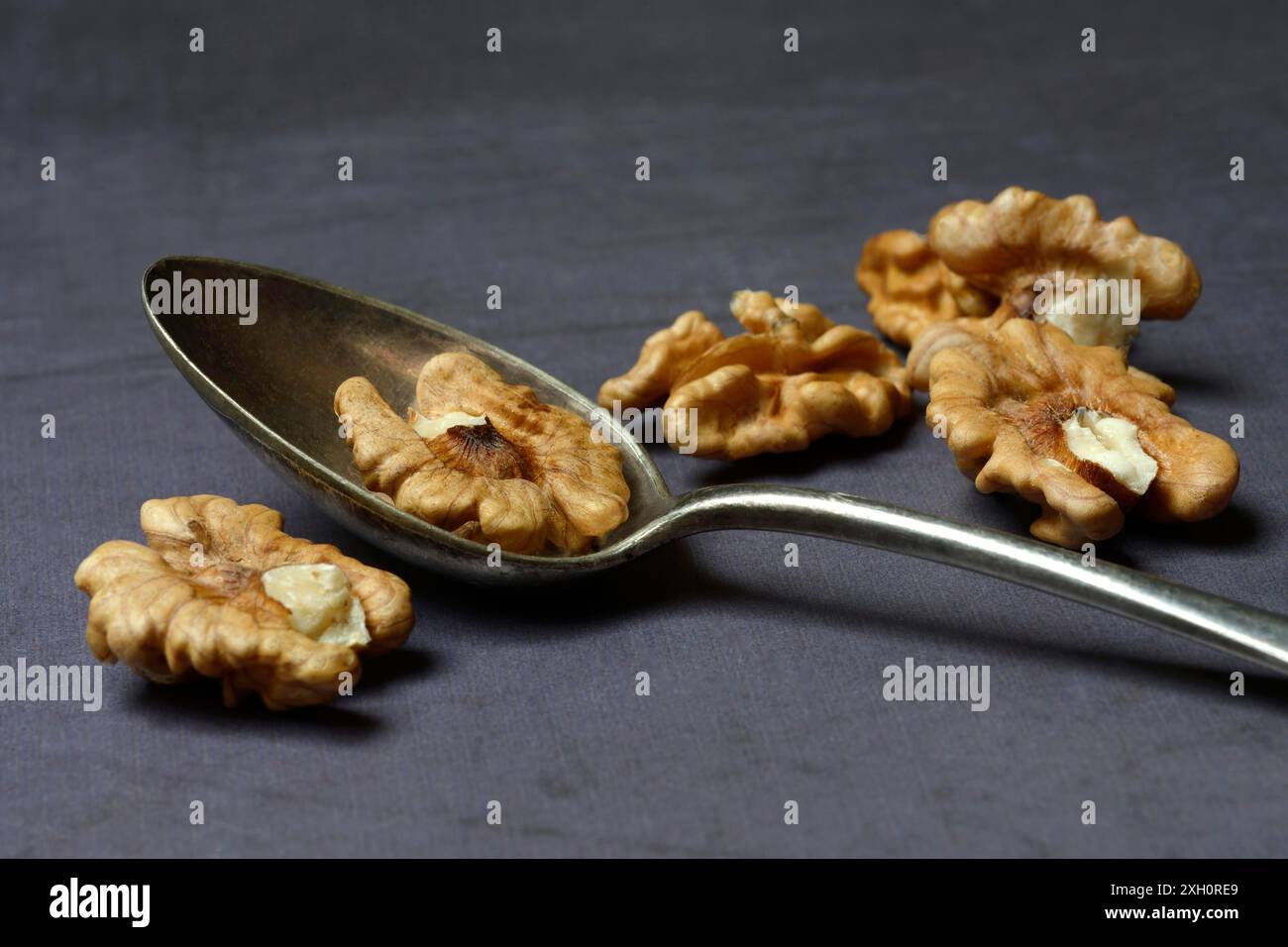 Walnut, Juglans regia, walnuts in spoons Stock Photo - Alamy