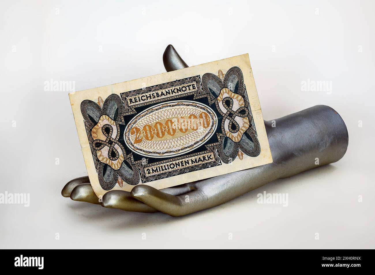 Reichsbank note, two million marks. on silver hand Stock Photo - Alamy