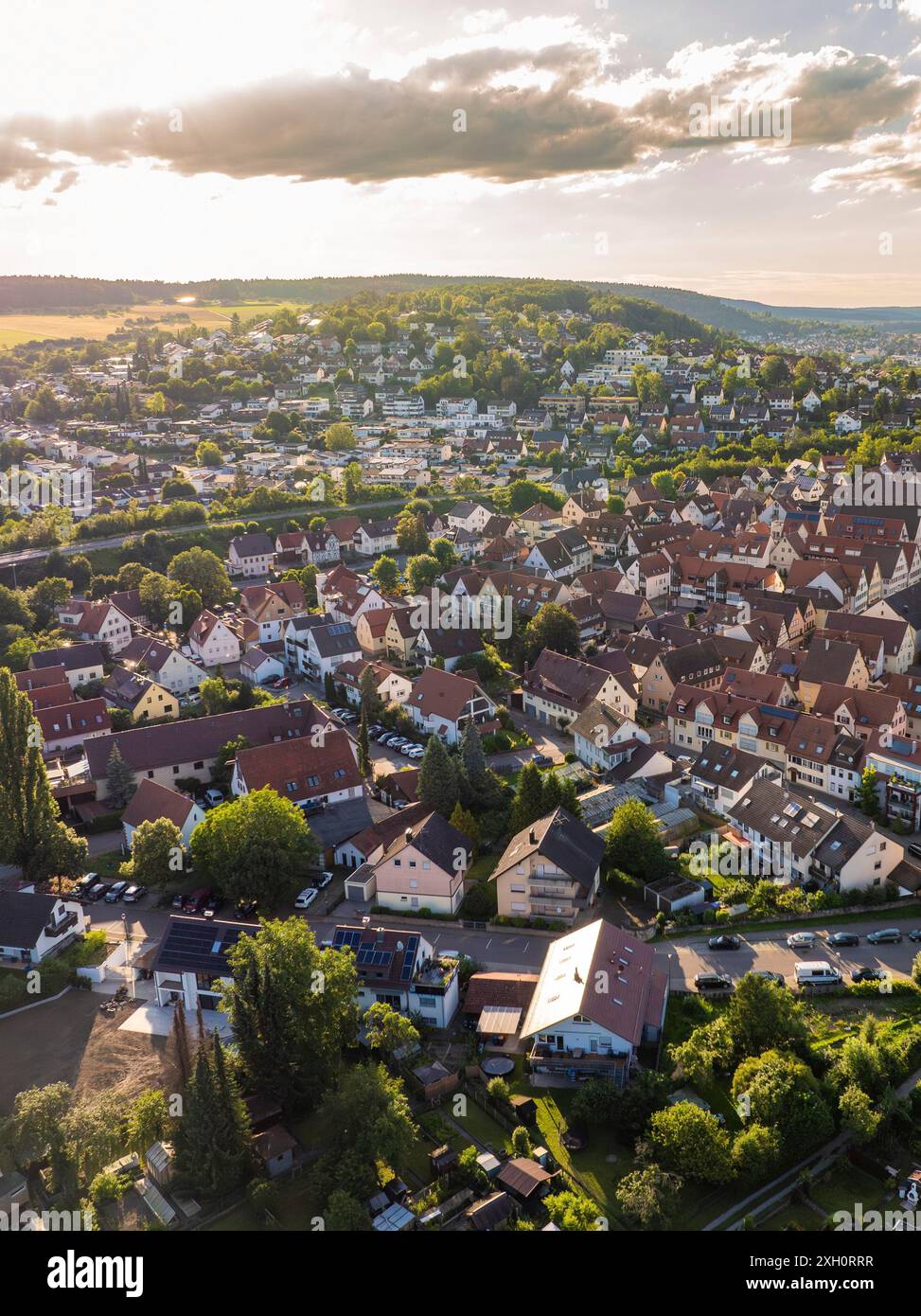 A quiet residential neighbourhood with many houses and green nature ...