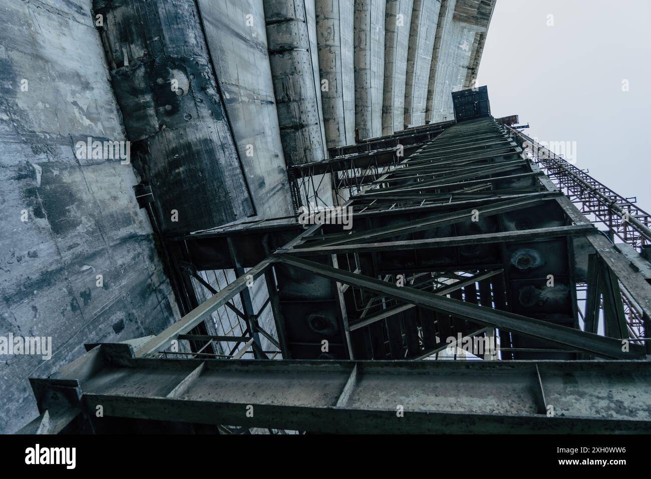 View from below of industrial structure with metal beams and concrete ...