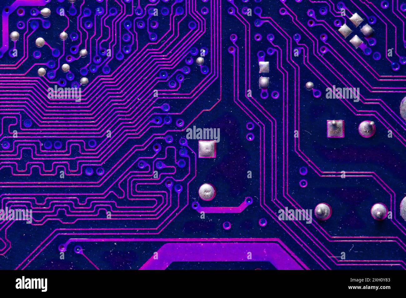 Printed neon purple circuit board. Electronic computer technology ...