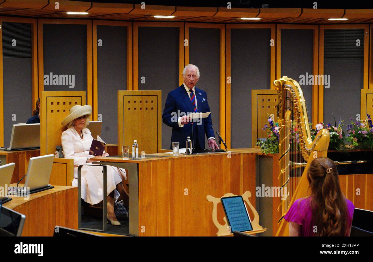 King Charles III address the Senedd in Cardiff, as Queen Camilla looks ...