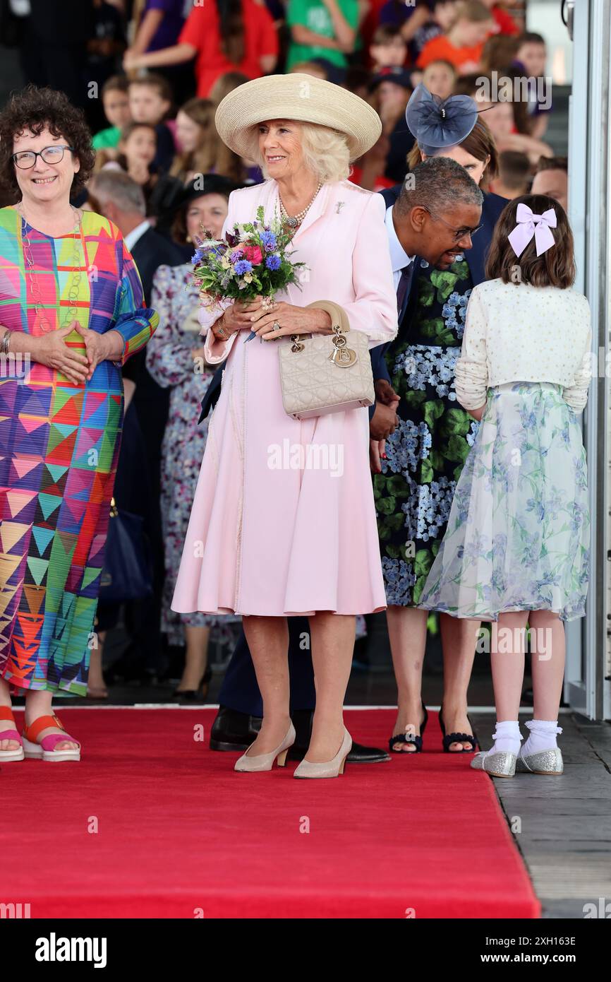 Queen Camilla smiles during a visit to the Senedd in Cardiff to mark ...