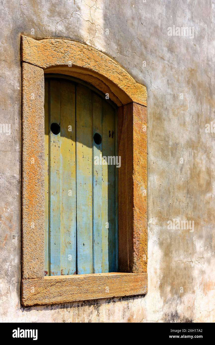 Historic church window in colonial style with stone frame in the ...