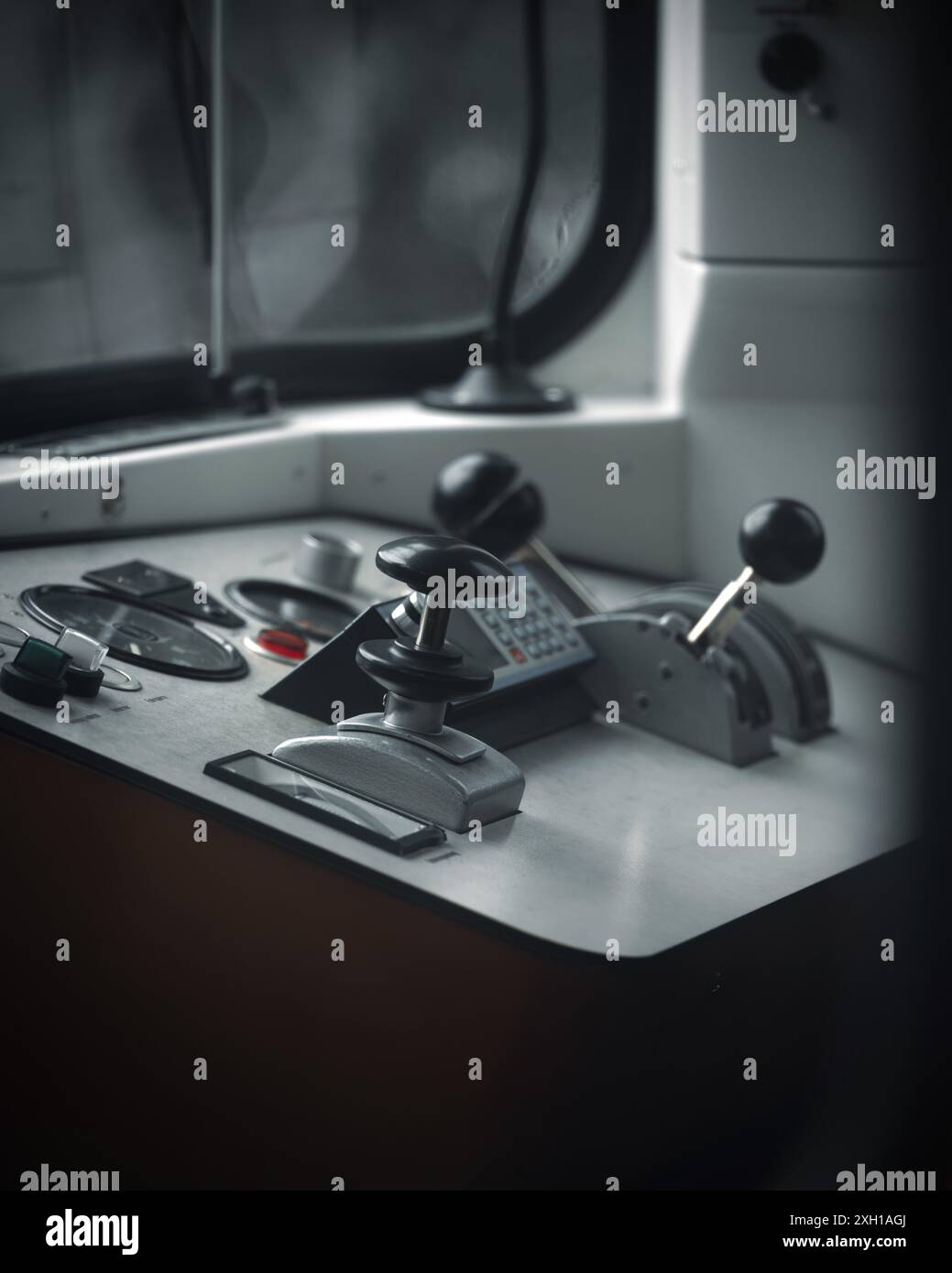 A close-up view of a train control panel with various levers and ...