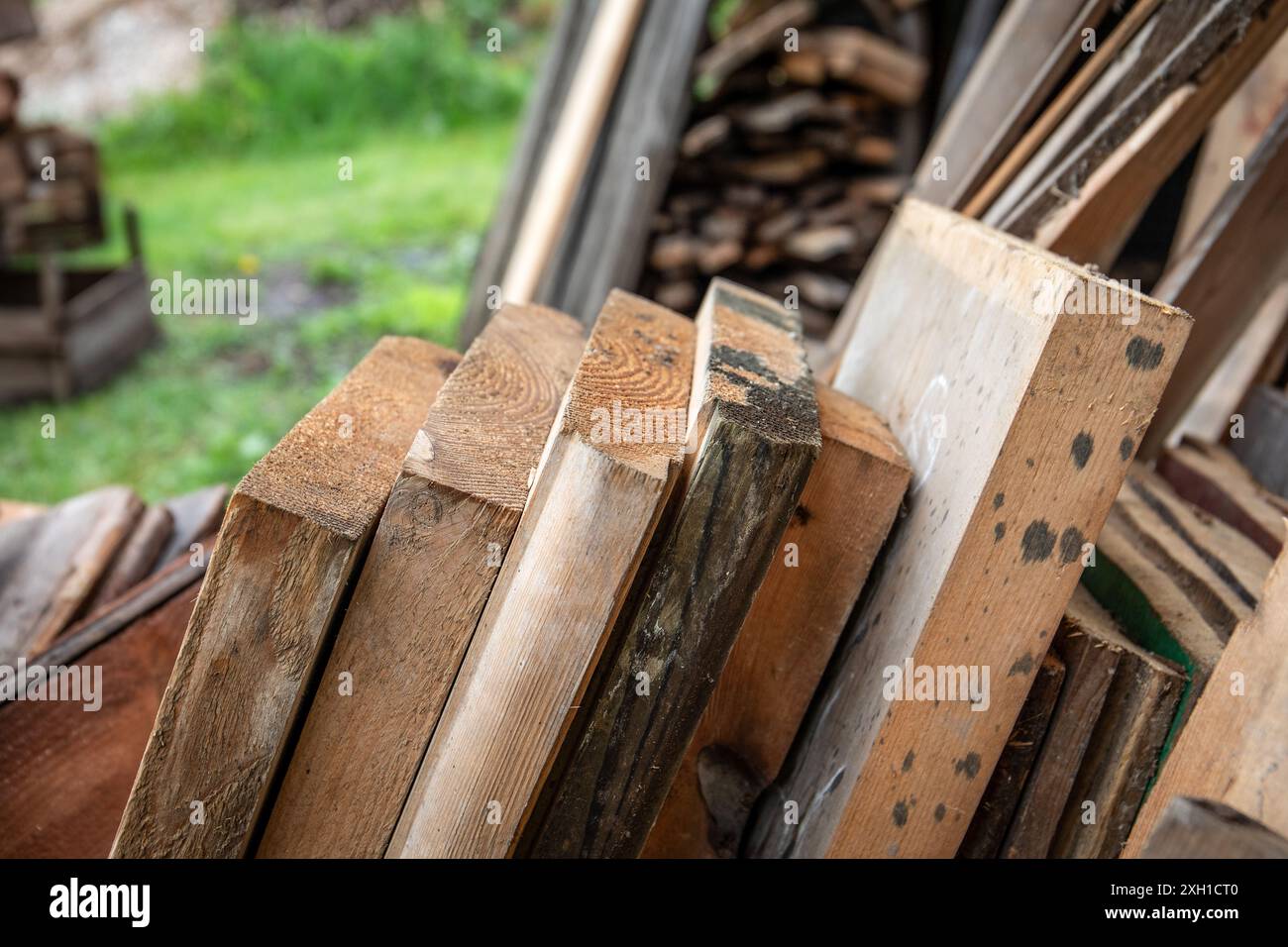Remnants of old boards, timber waste and building materials Stock Photo ...