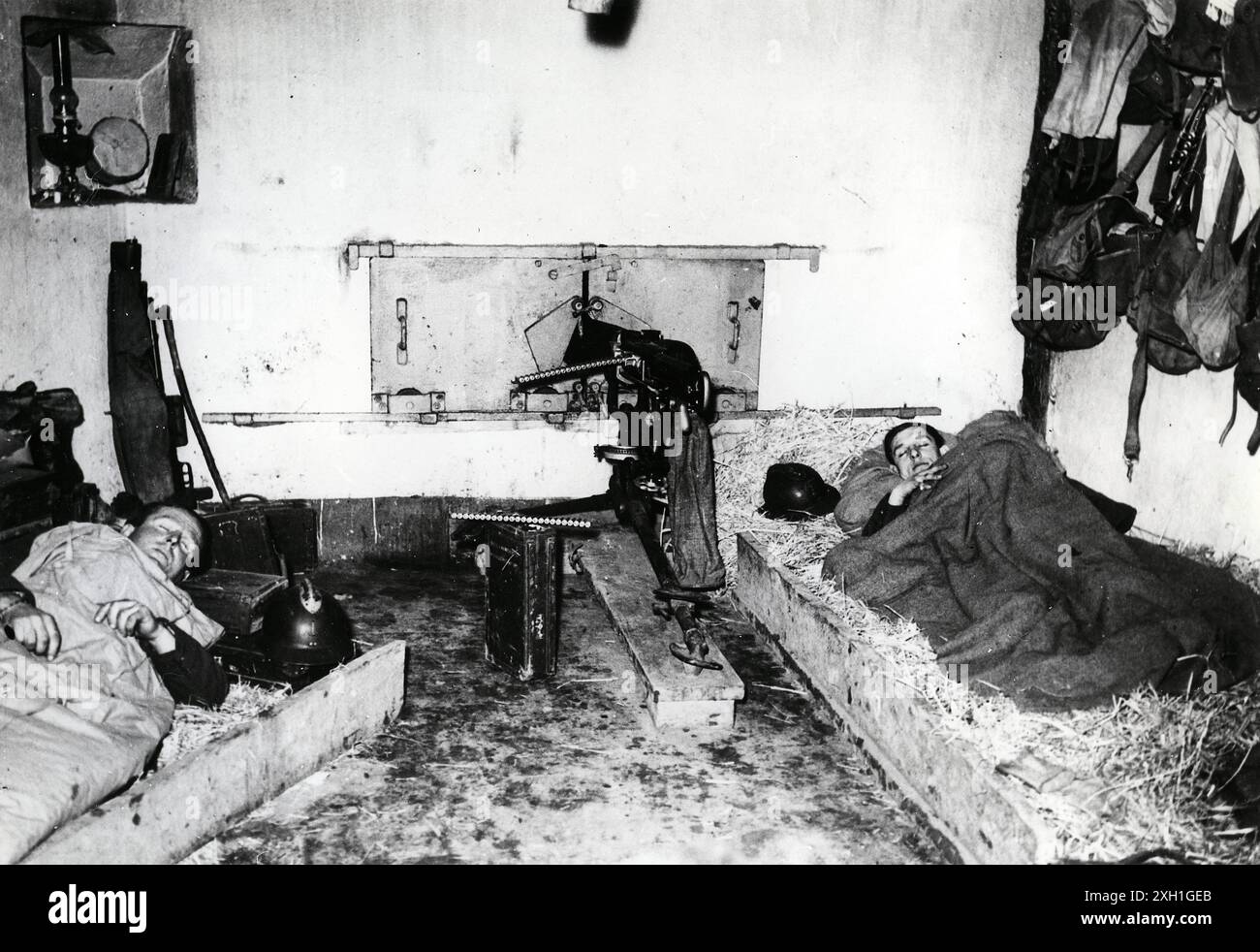 French soldiers in their bunker, sleeping with their machine gun ...
