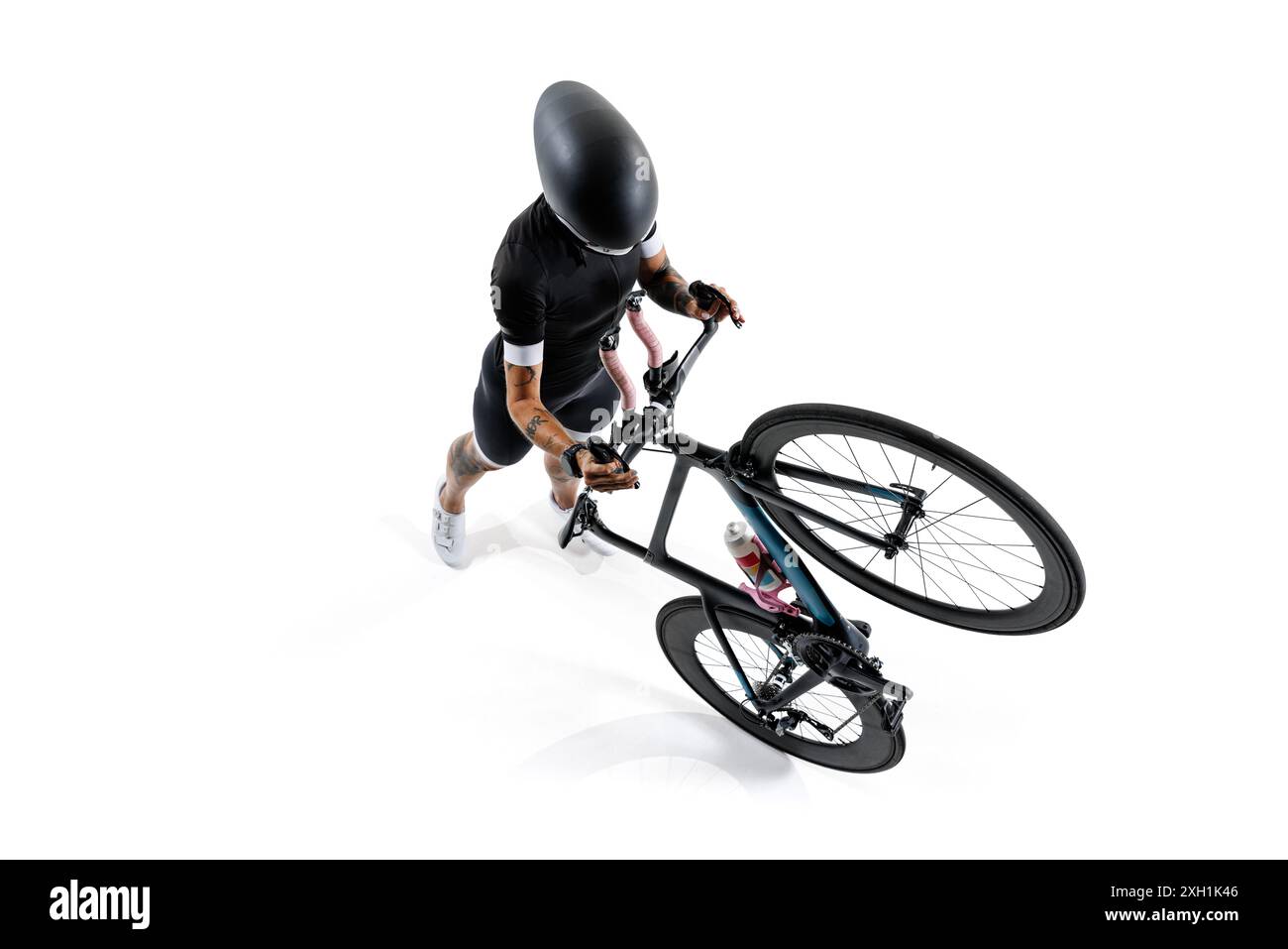 Athlete, woman in black cycling attire, equipped with aerodynamic ...