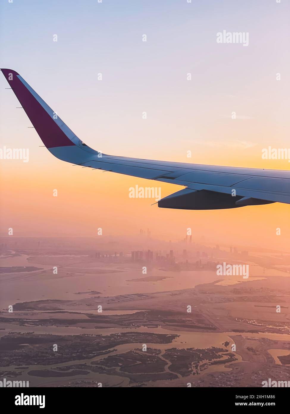 Passengers point of view window panorama of Abu Dhabi skyline and city ...