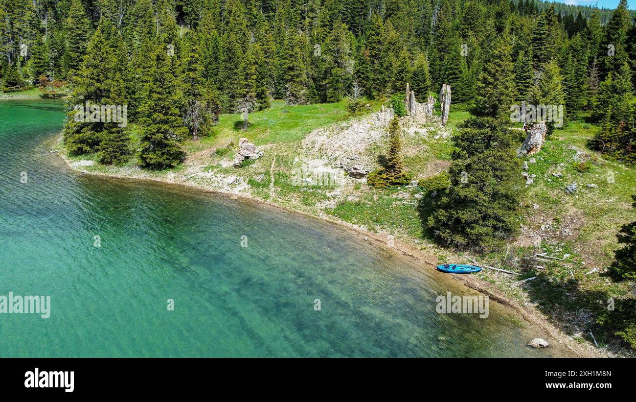 Aerial view of a kayak on the beautiful teal blue waters of Crystal ...