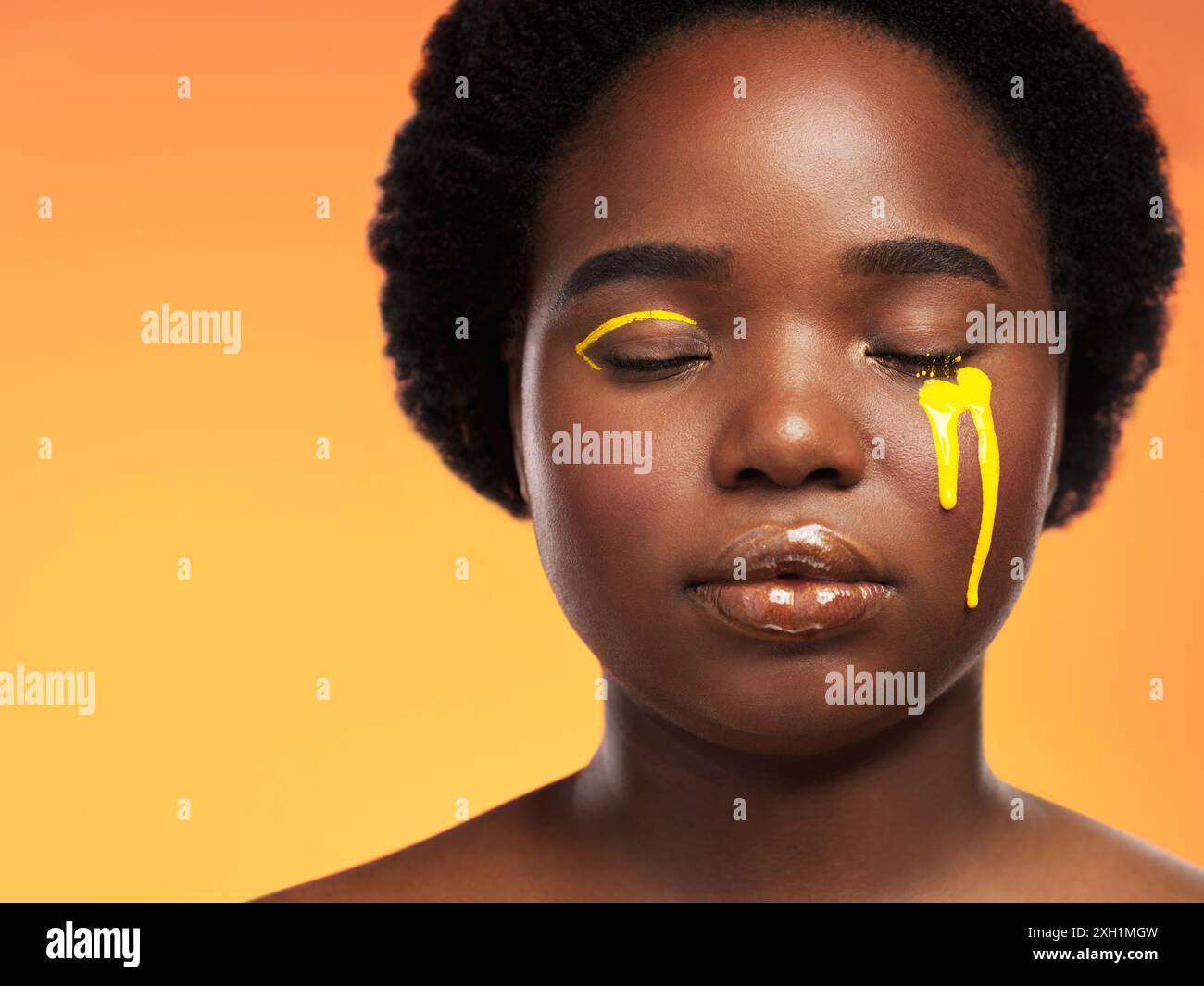 Black woman, tears and makeup or paint on studio background with ...