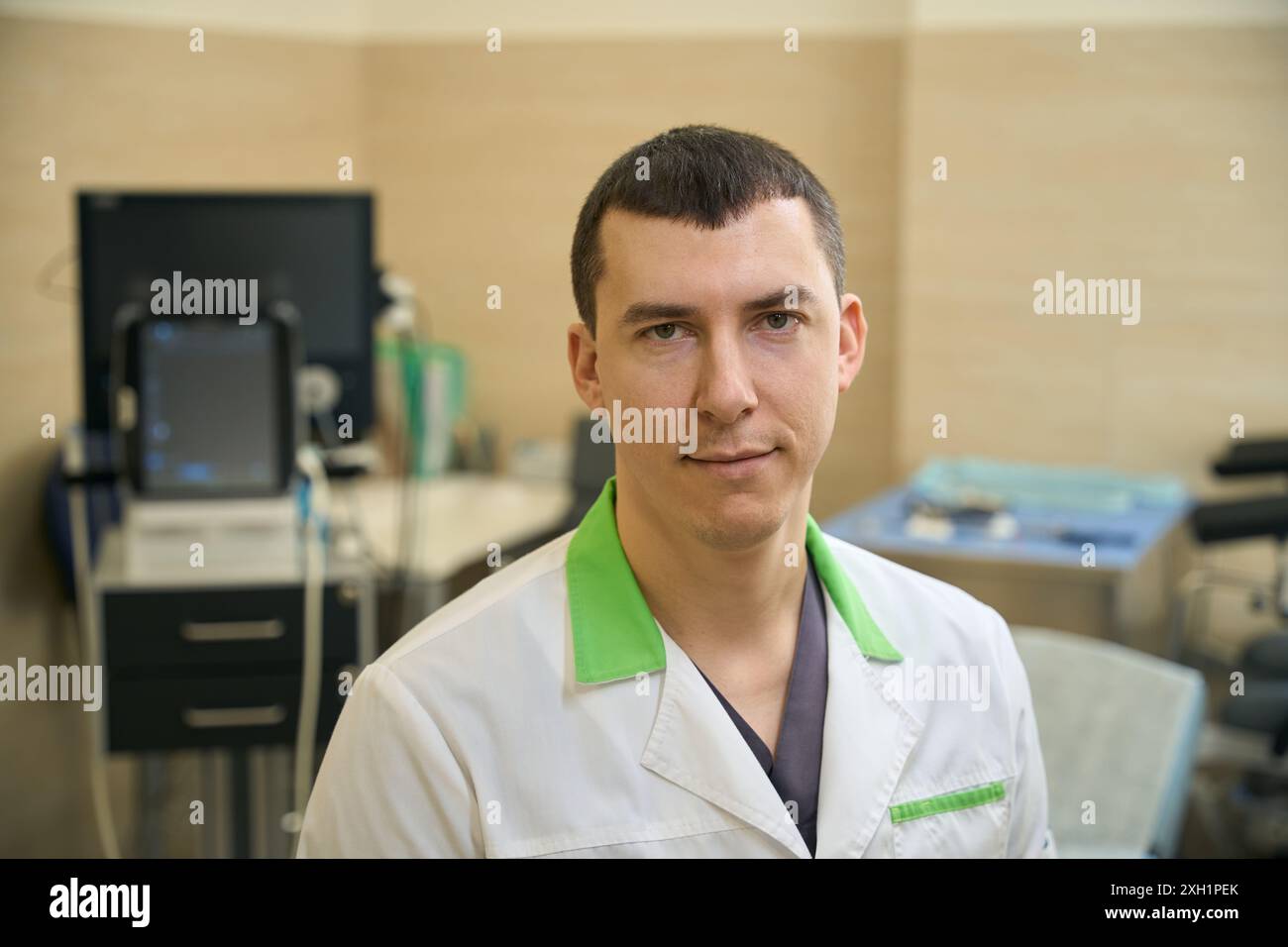 Diagnostic medical sonographer in examination room with ultrasonic ...