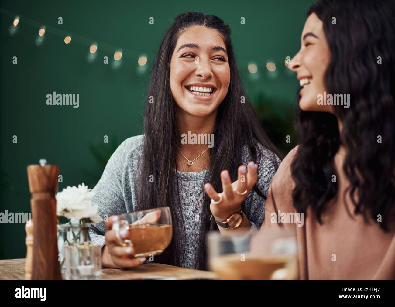 Girl, teenager and sisters in coffee shop, talking and happy for ...