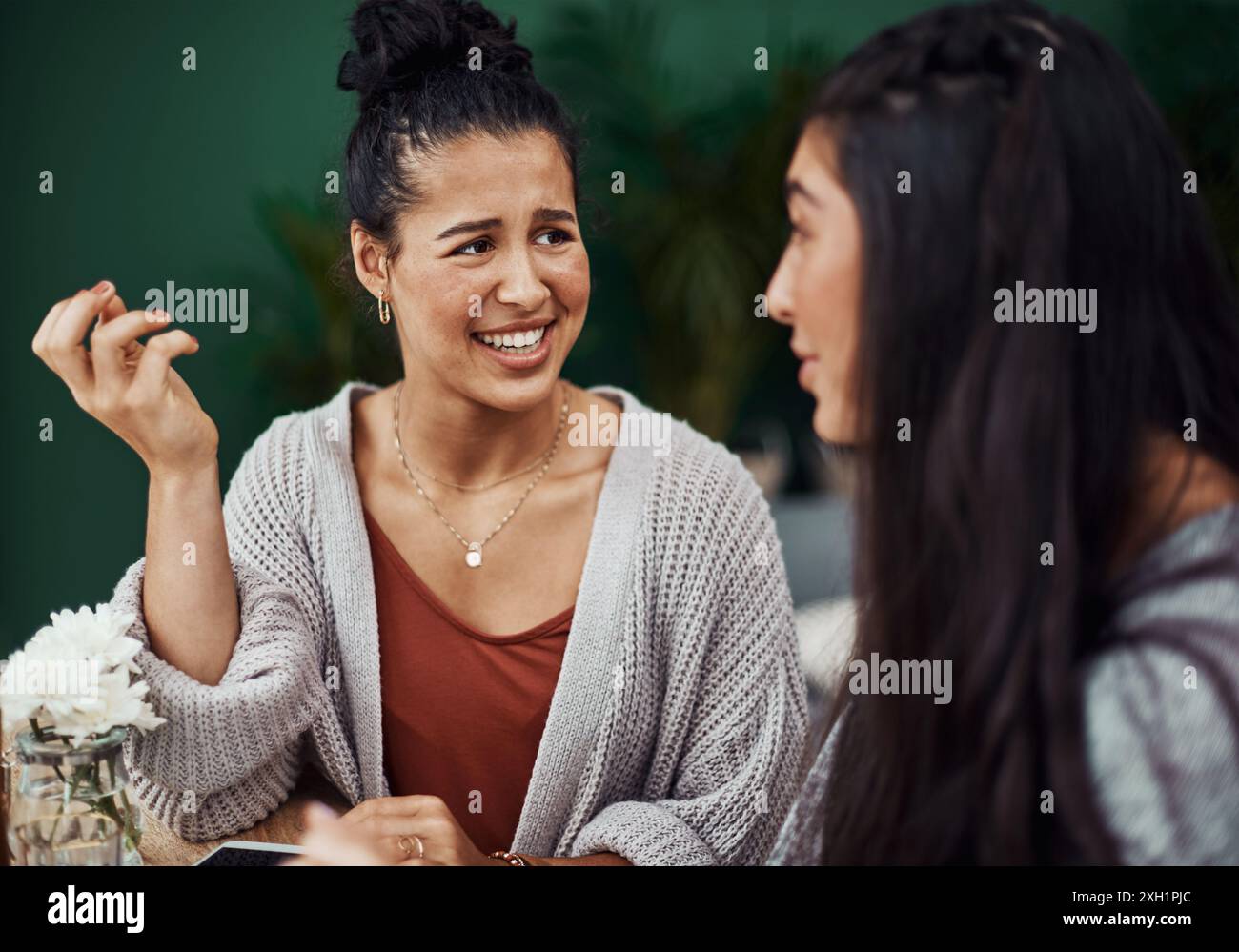 Bonding, sisters and talking in cafe, smile and listening to gossip of ...