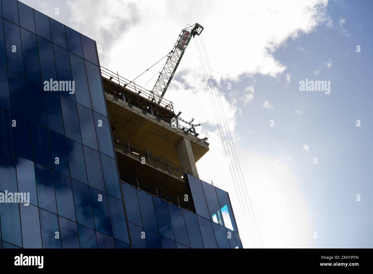 Construction, highrise apartments, crane operating Stock Photo - Alamy