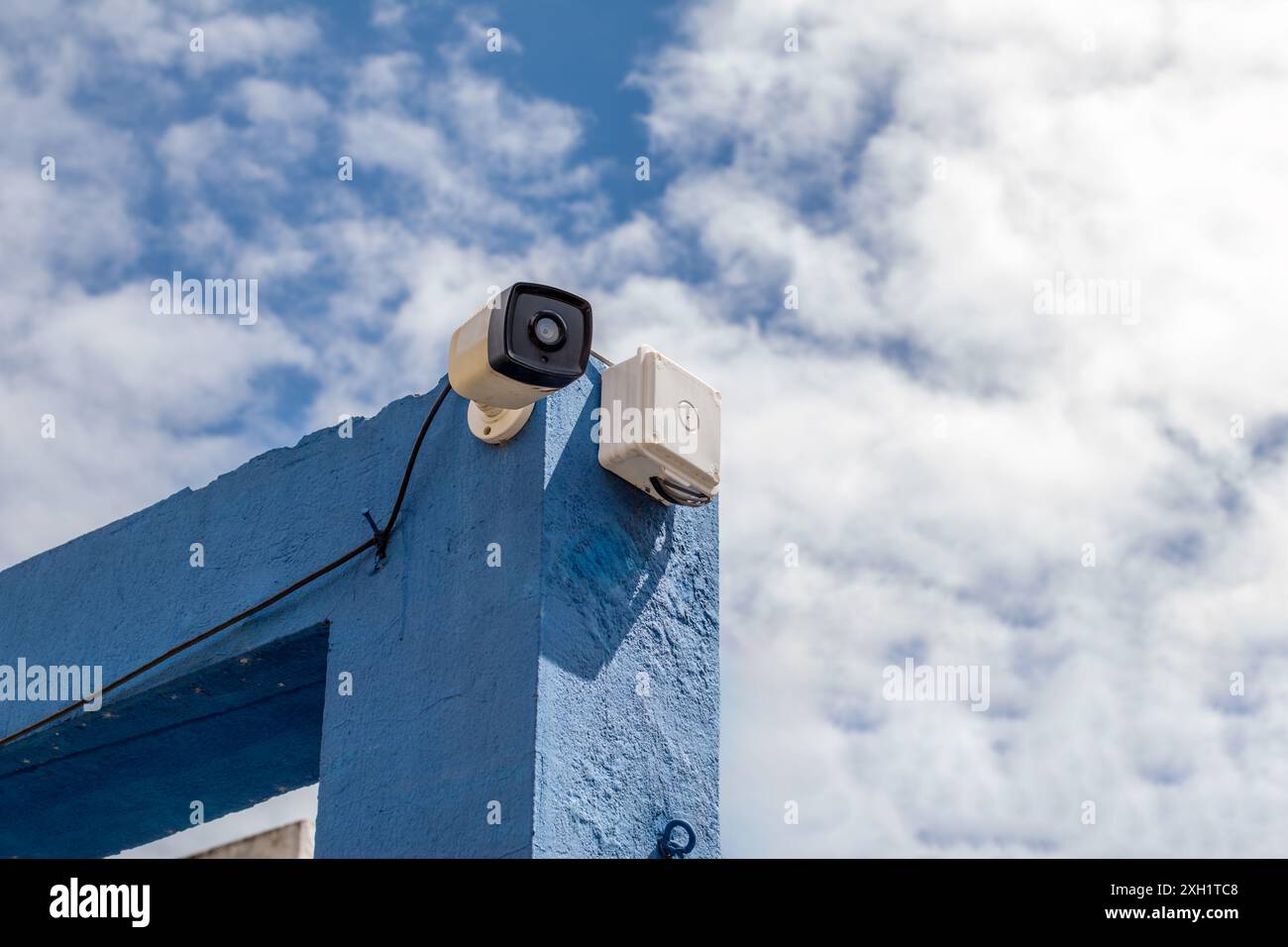 concepts: private security. surveillance camera records the entry of ...