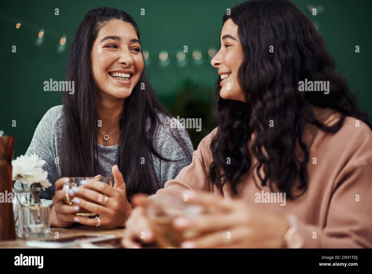 Friends, smile and chat in cafe, happy and listening to gossip of high ...