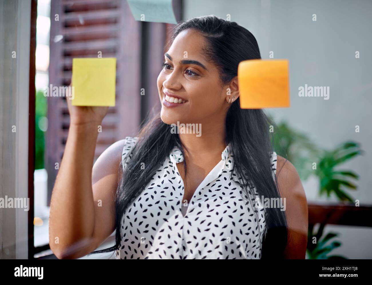 Woman, sticky notes and glass for solution in office, planning and ...