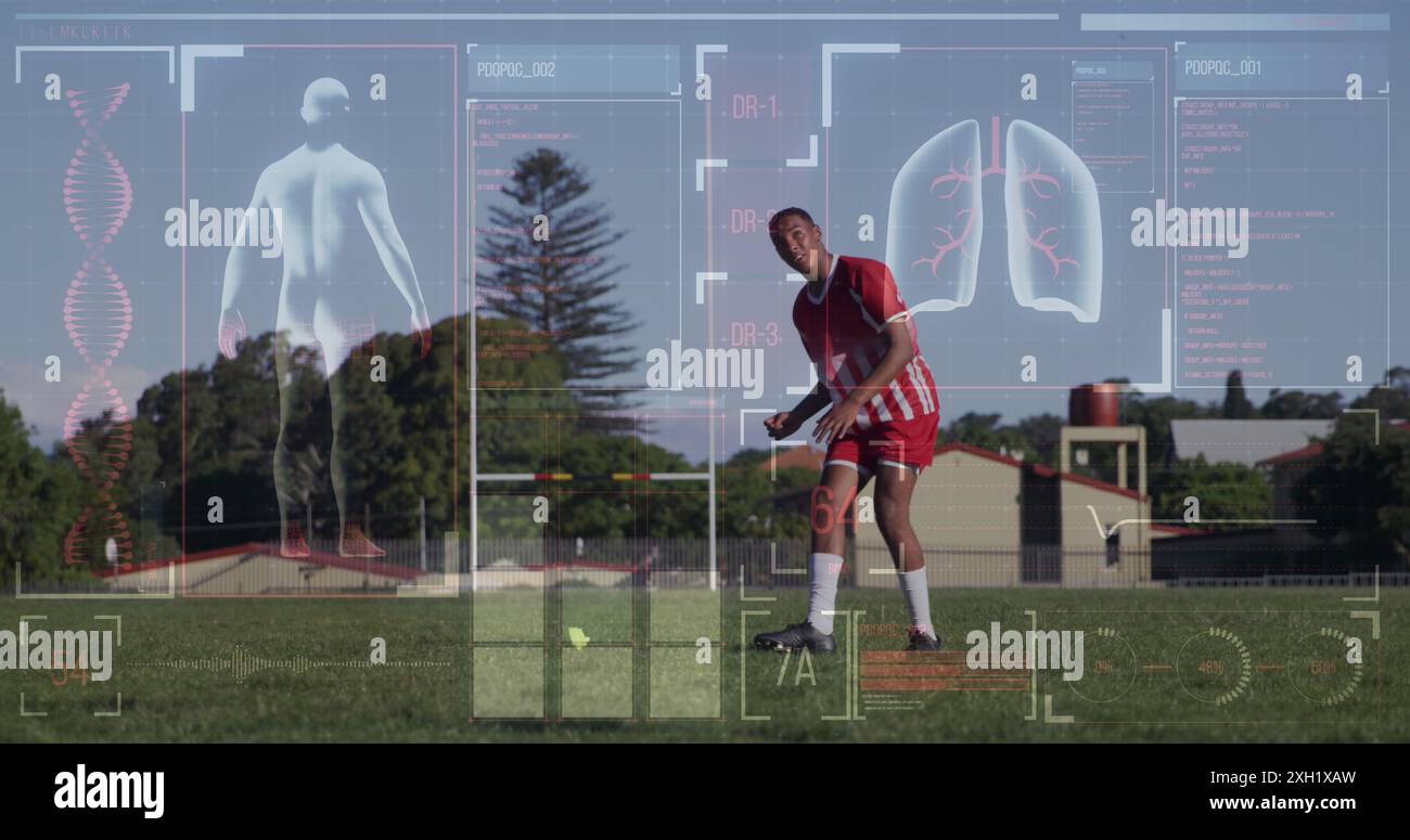 Image of screen with biological data over biracial male soccer player ...