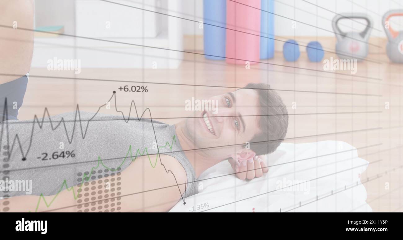 Image of graphs and numbers on caucasian physiotherapist stretching leg ...