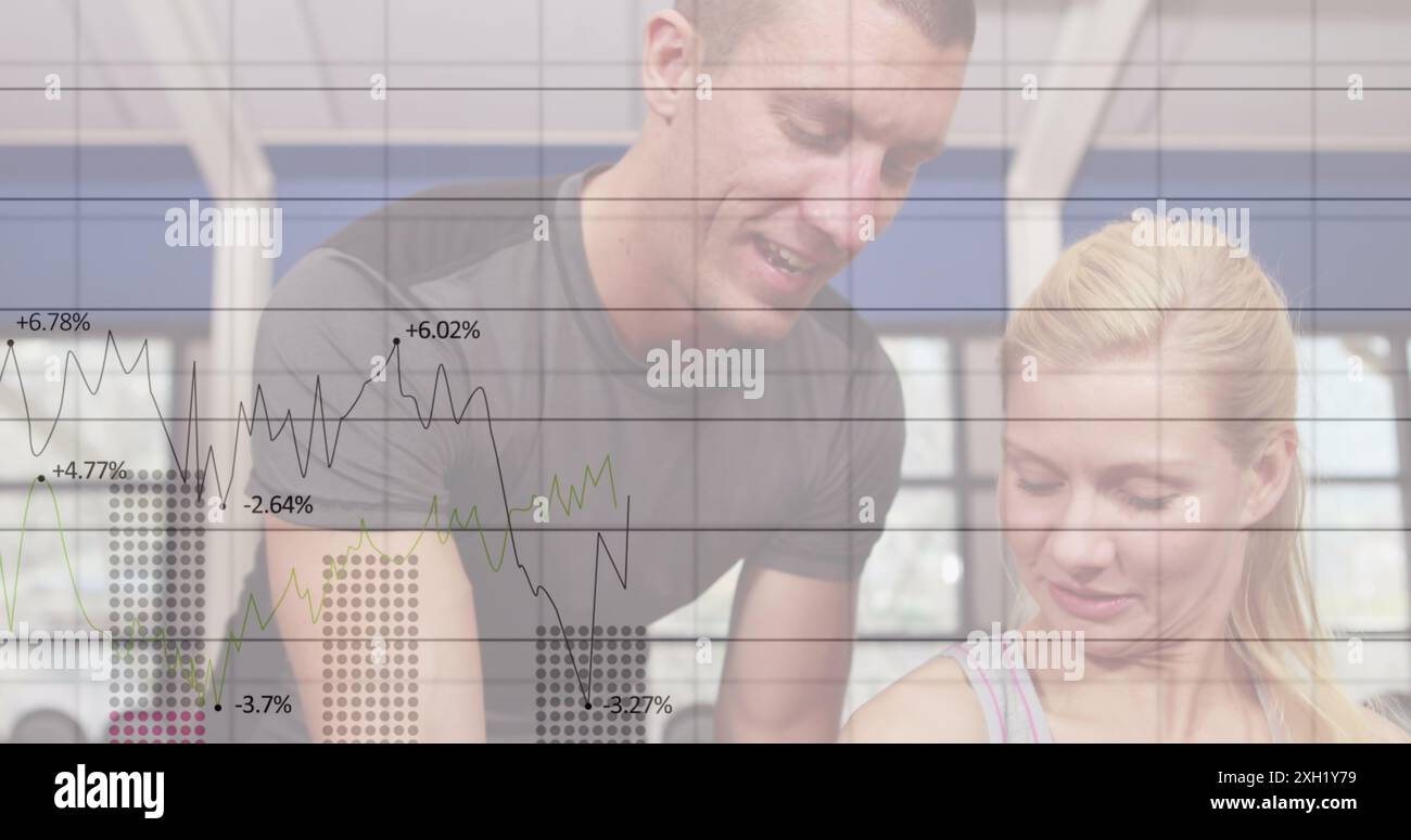 Image of graphs and numbers on caucasian male trainer helping woman in ...