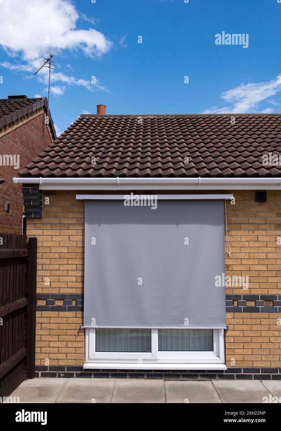 Sun blind on patio window Stock Photo - Alamy