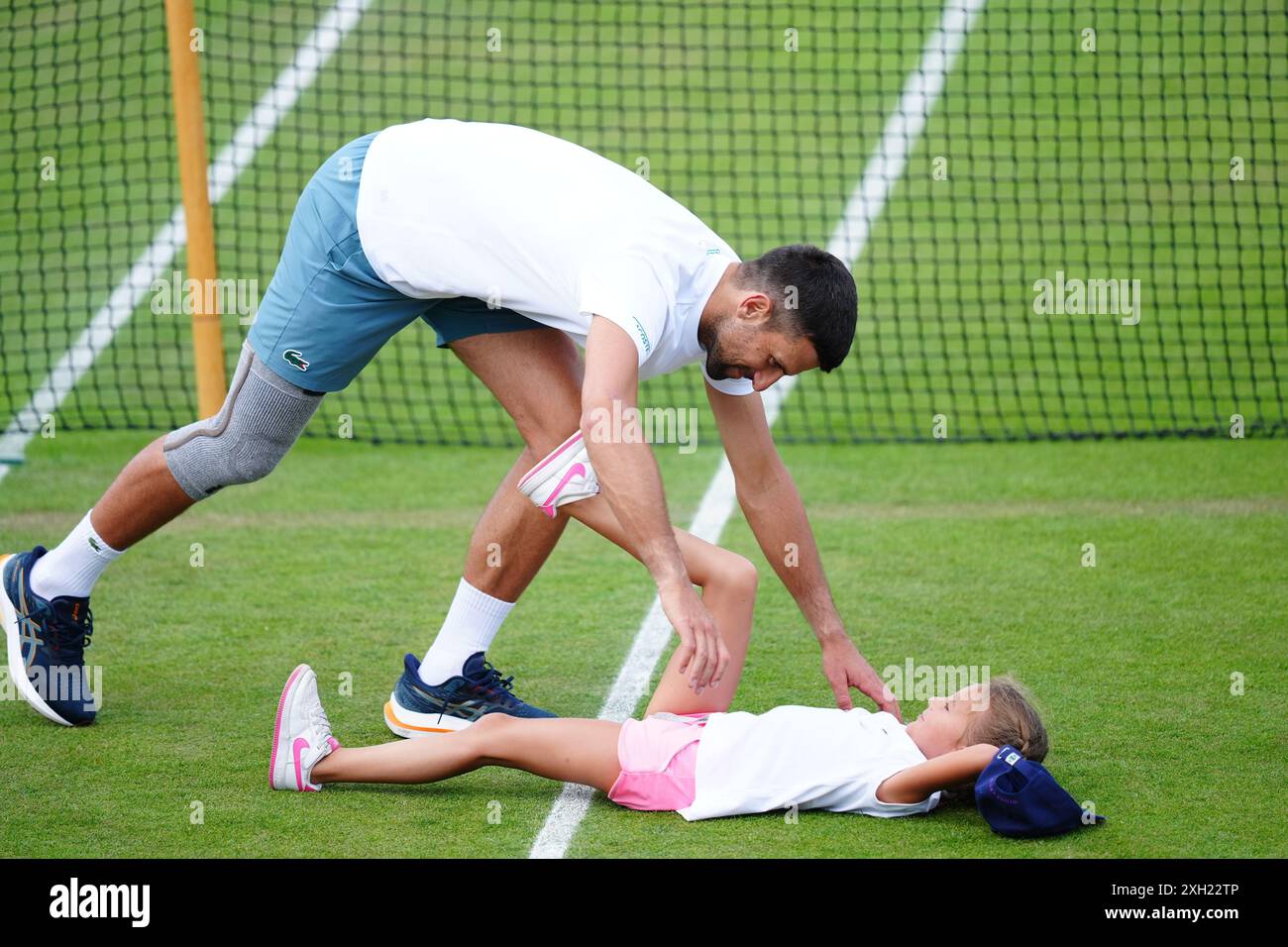 Novak Djokovic and his daughter Tara on day eleven of the 2024 ...