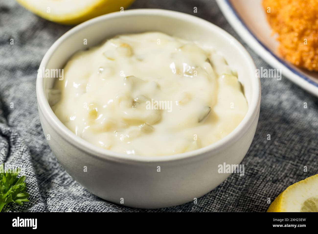 Savory Healthy White Tartar Sauce with Lemon for Fish Stock Photo - Alamy