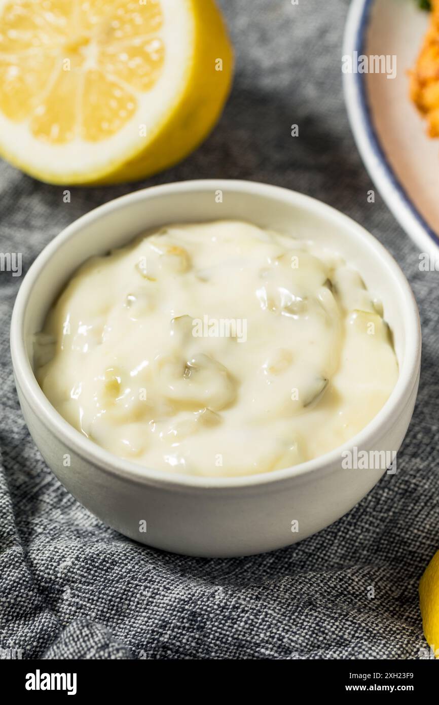 Savory Healthy White Tartar Sauce with Lemon for Fish Stock Photo - Alamy