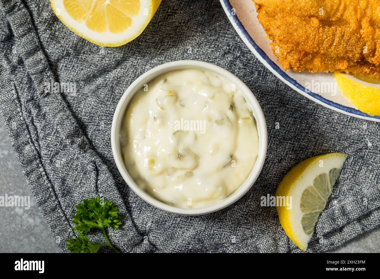 Savory Healthy White Tartar Sauce with Lemon for Fish Stock Photo - Alamy
