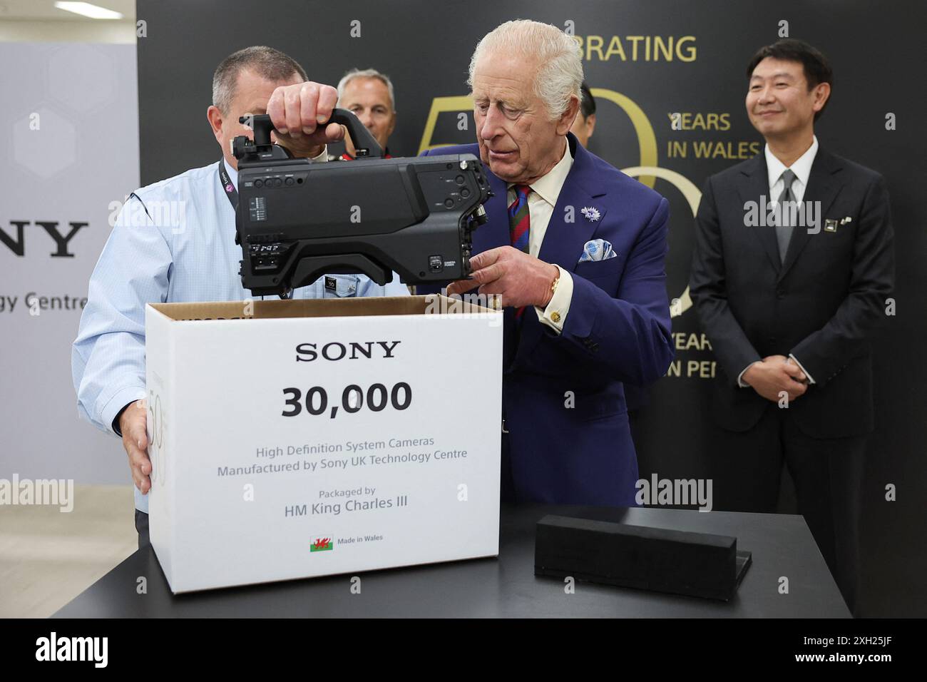 King Charles III packs the 30,000th Sony HD system camera during a ...