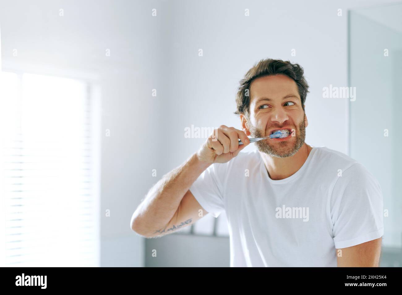 Dental care, man or brushing teeth in bathroom for hygiene, whitening ...