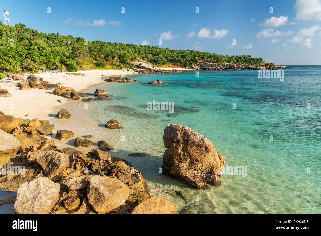 Picturesque tropical golden sandy Sunset Beach with turquoise water on ...
