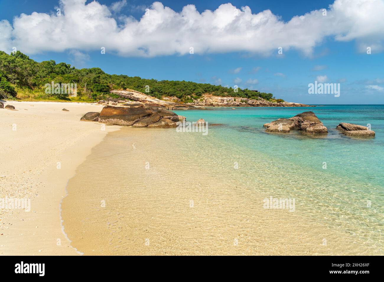 Picturesque tropical golden sandy Sunset Beach with turquoise water on ...