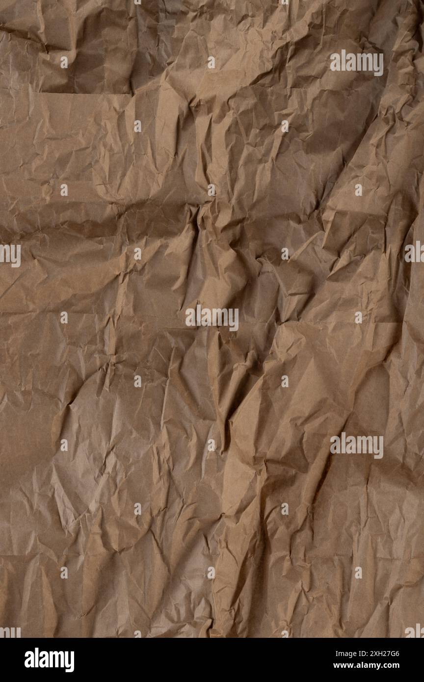 Wrinkled brown paper background macro close up view Stock Photo - Alamy
