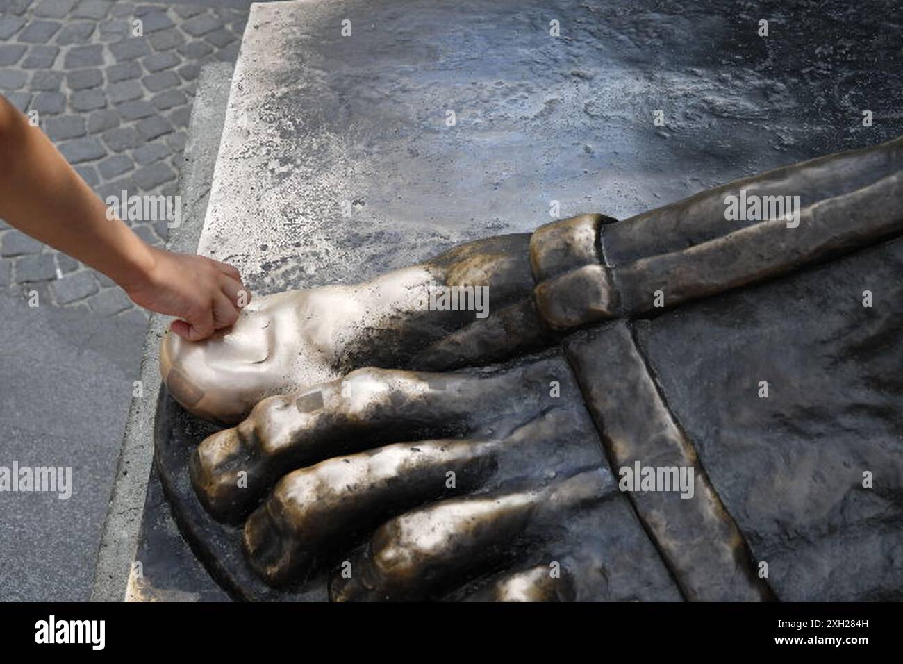 Split, Croatia. 11th Aug, 2023. A boy touches the big toe of the ...